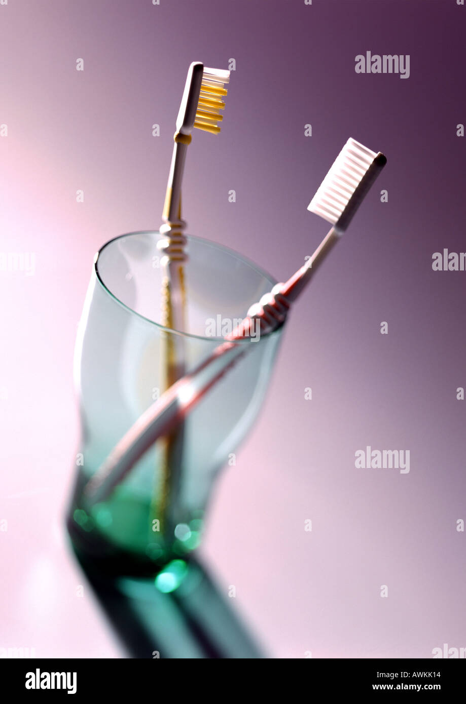 Toothbrushes in glass Stock Photo - Alamy