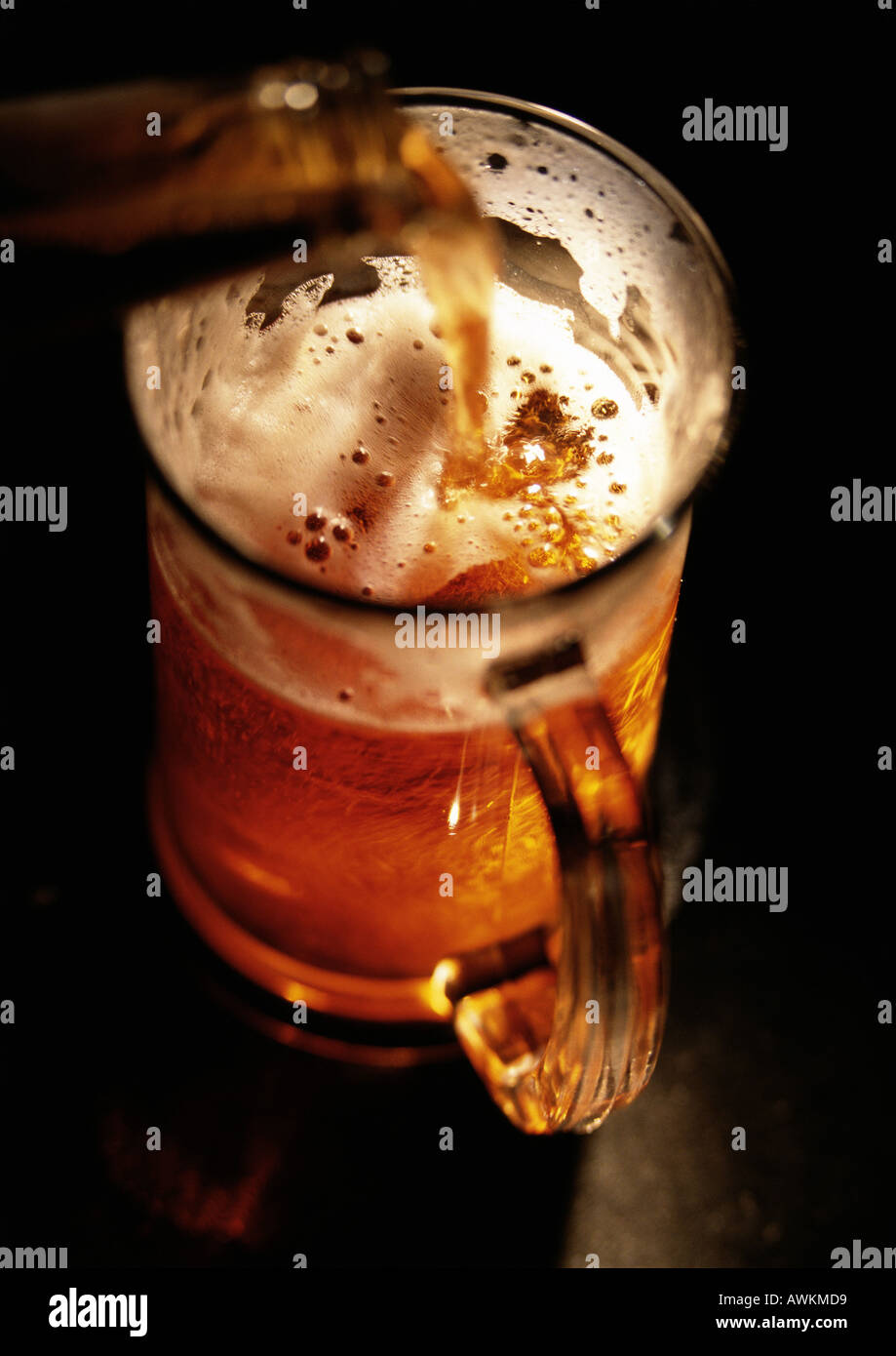 Beer being poured mug high hi-res stock photography and images - Alamy