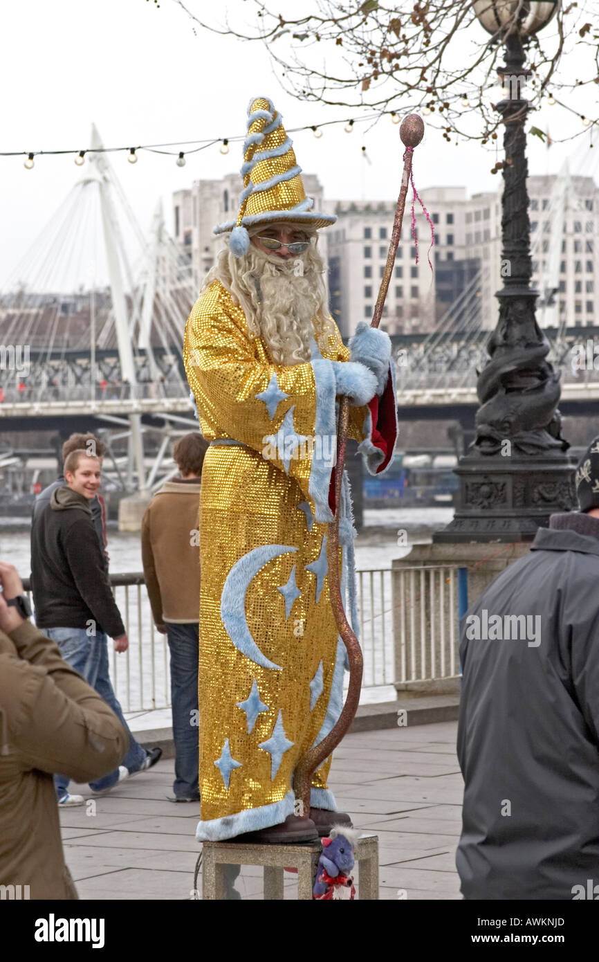 People with human statue busker figure on River Thames South Bank on ...