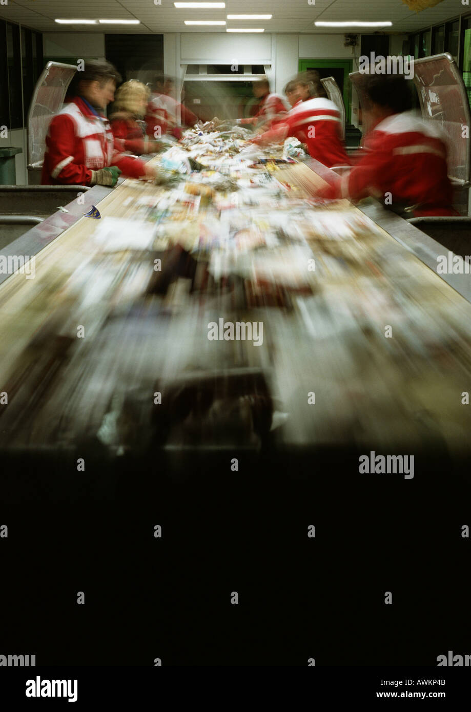 People working in assembly line, blurred Stock Photo - Alamy
