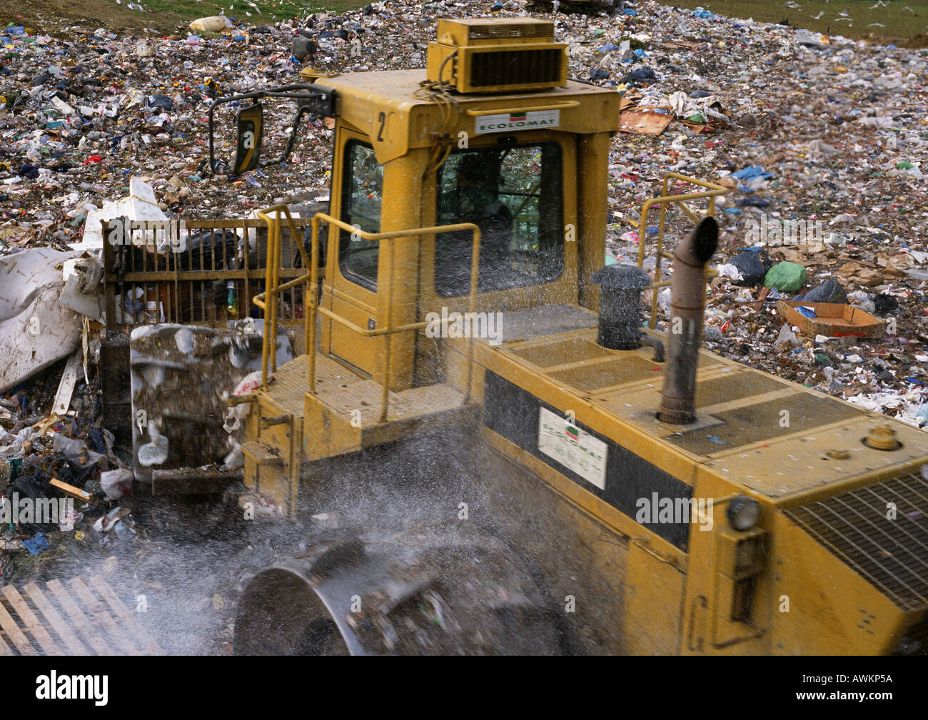 Bulldozer in trash dump Stock Photo - Alamy