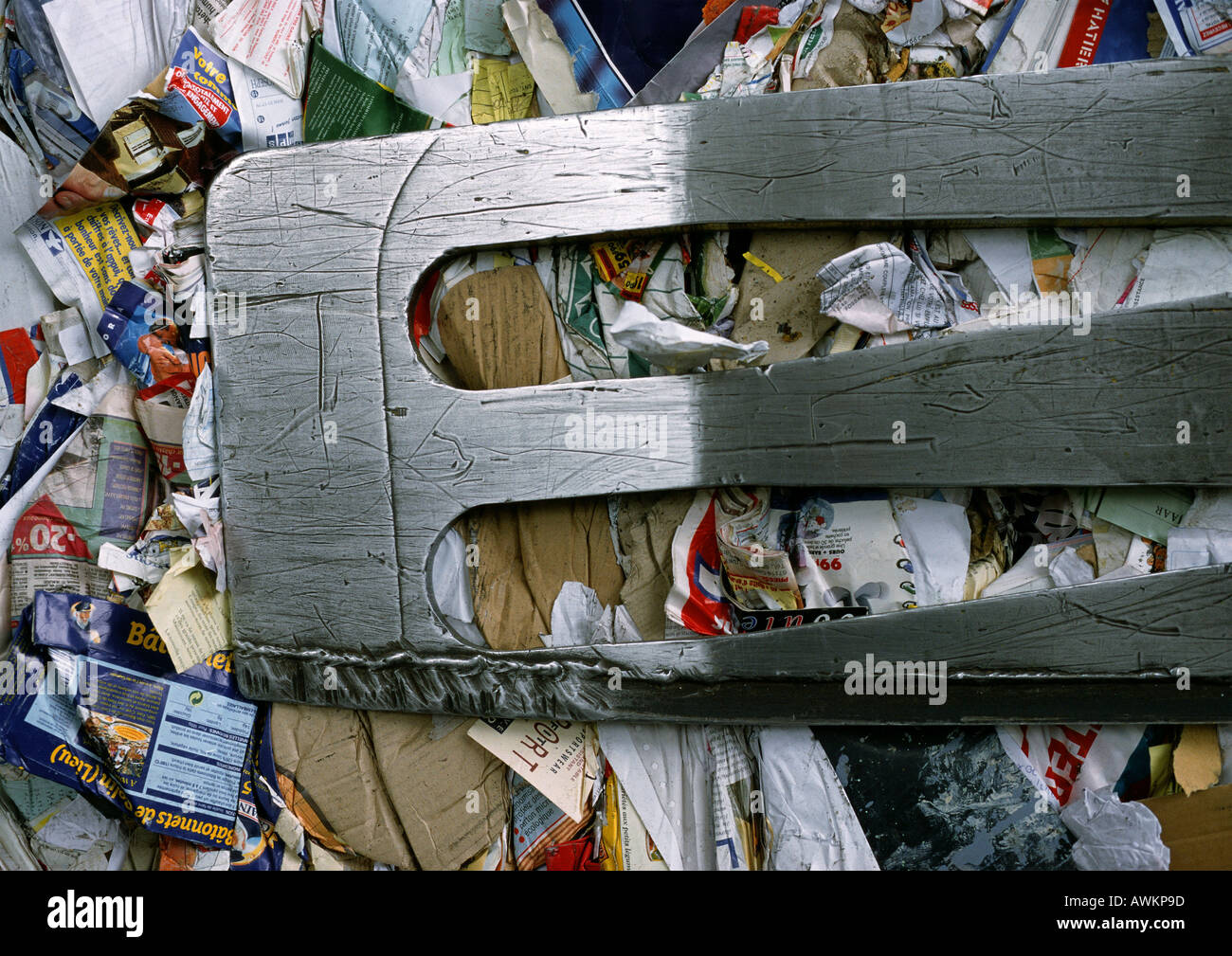 Paper and cardboard being compacted Stock Photo - Alamy