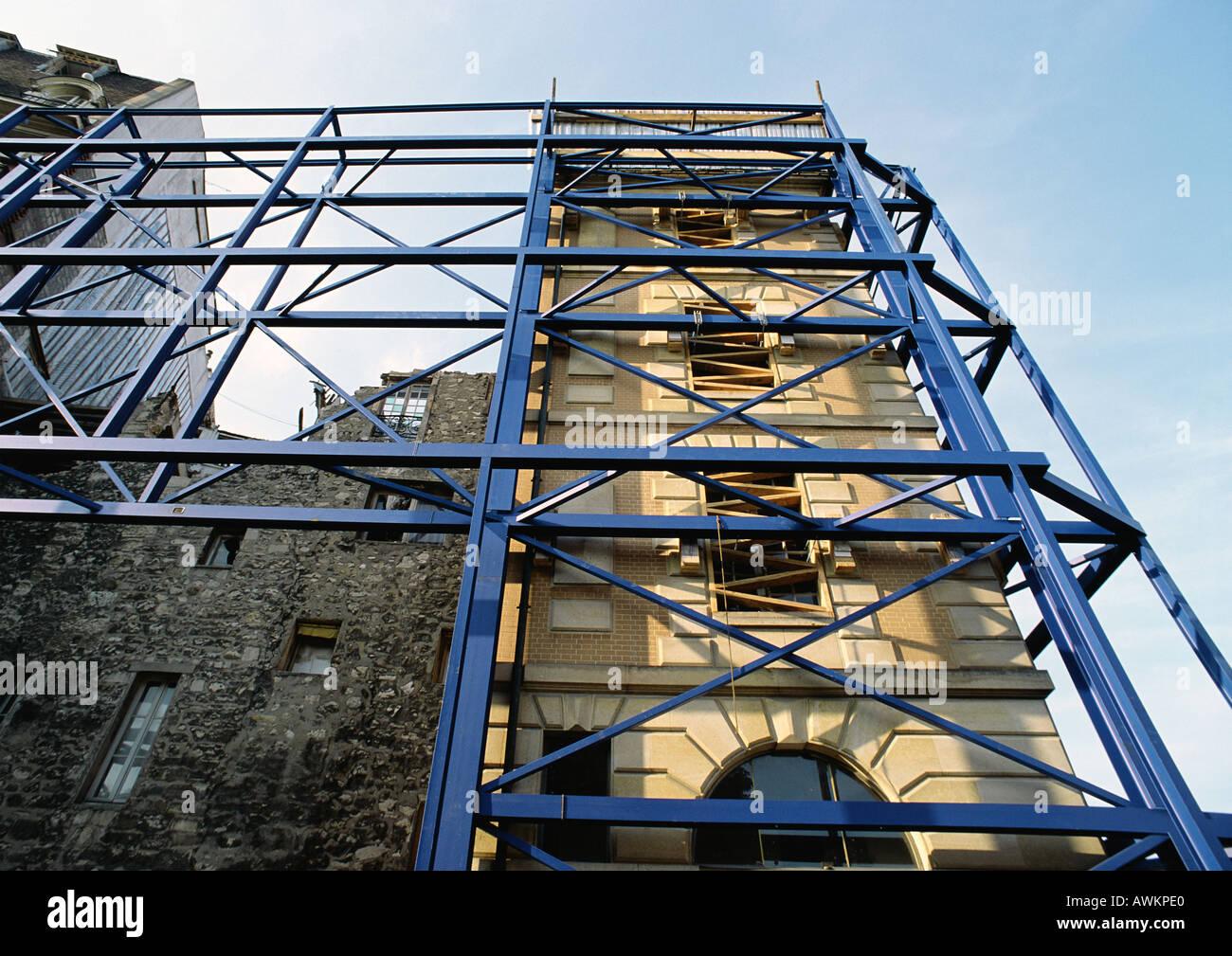 Scaffolding against building fronts, low angle view Stock Photo - Alamy
