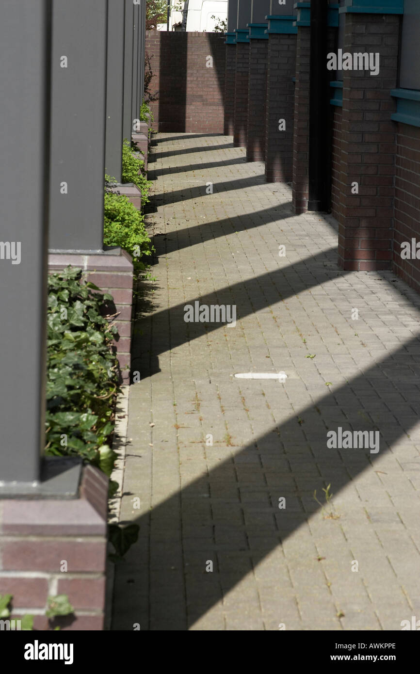 Architectural detail of column shadows outside office and warehouse ...