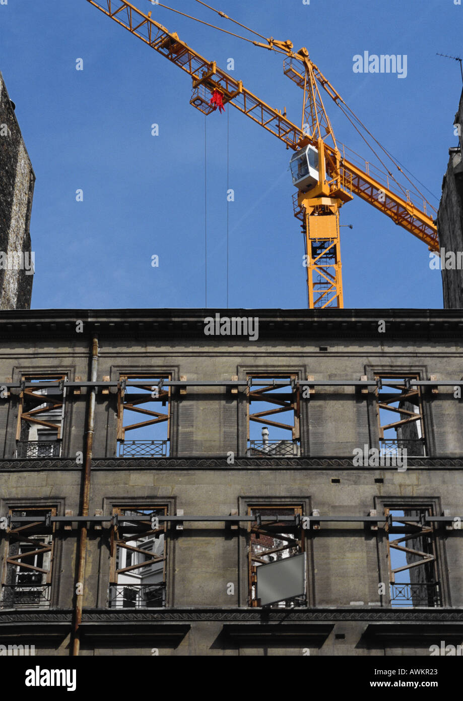 Building under construction, crane in background Stock Photo - Alamy