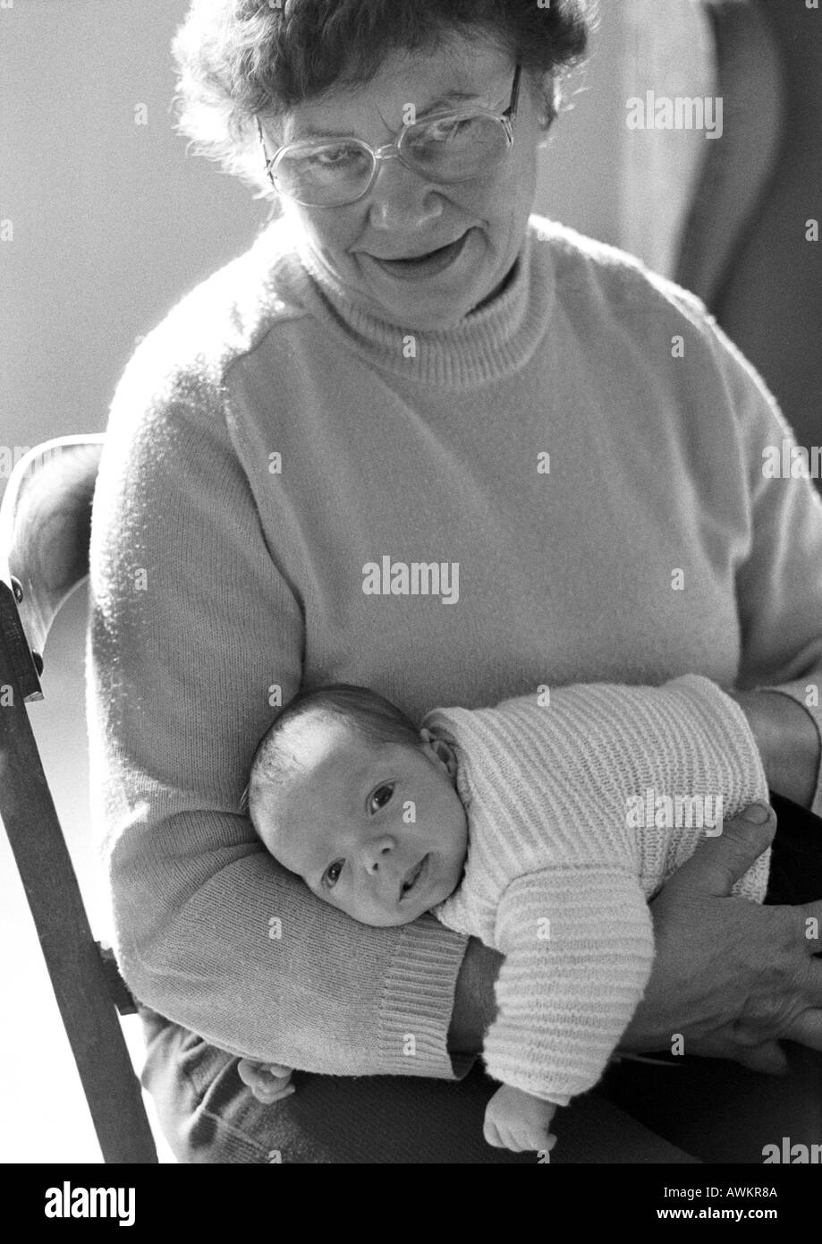 Old lady holding baby Black and White Stock Photos & Images - Alamy