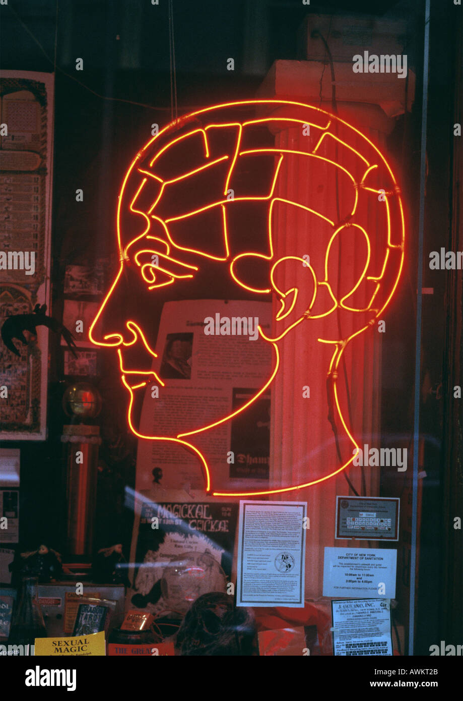 Neon head sign on store window Stock Photo - Alamy
