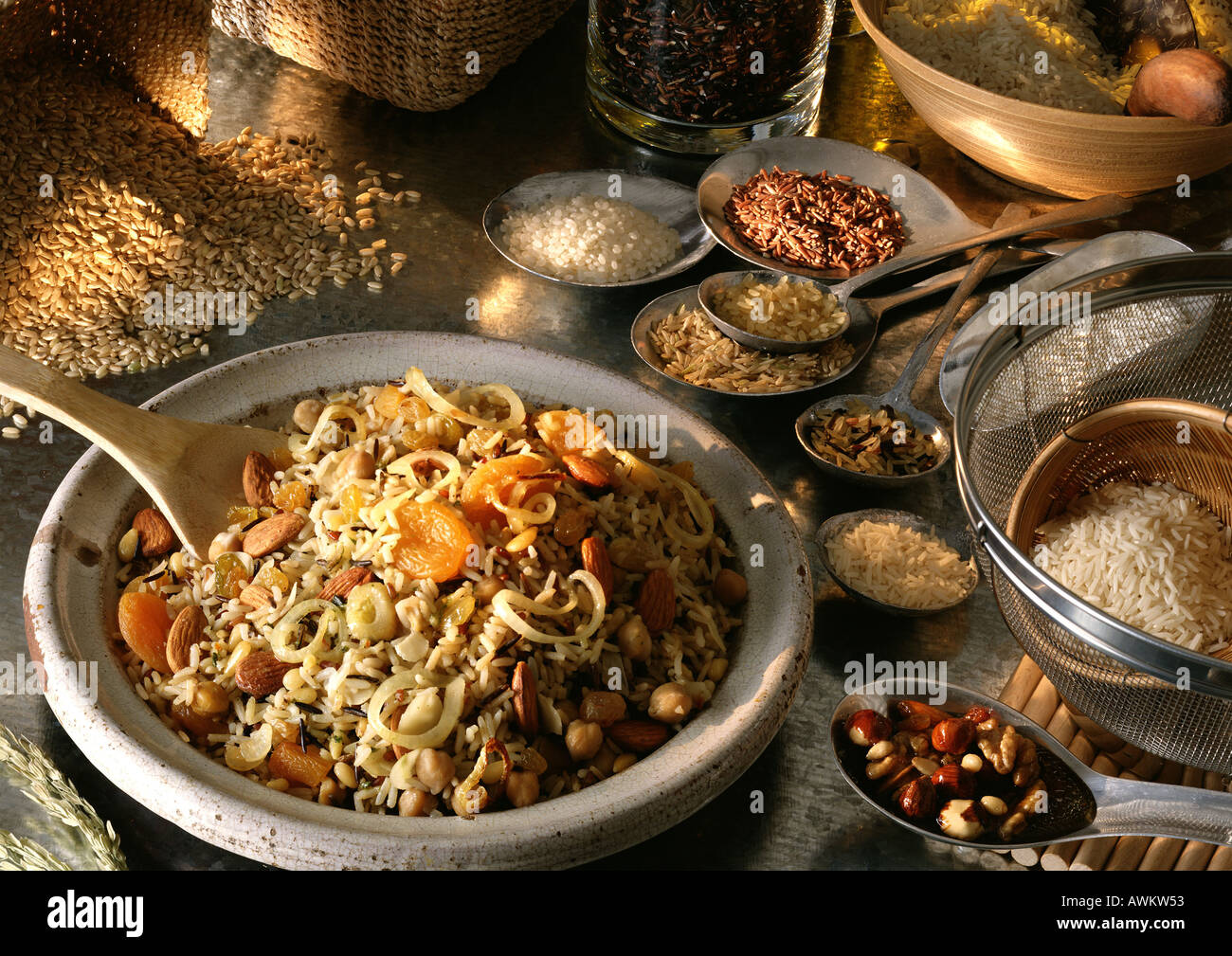 Cooked dish of rice with dried fruits and nuts, surrounded by various ...