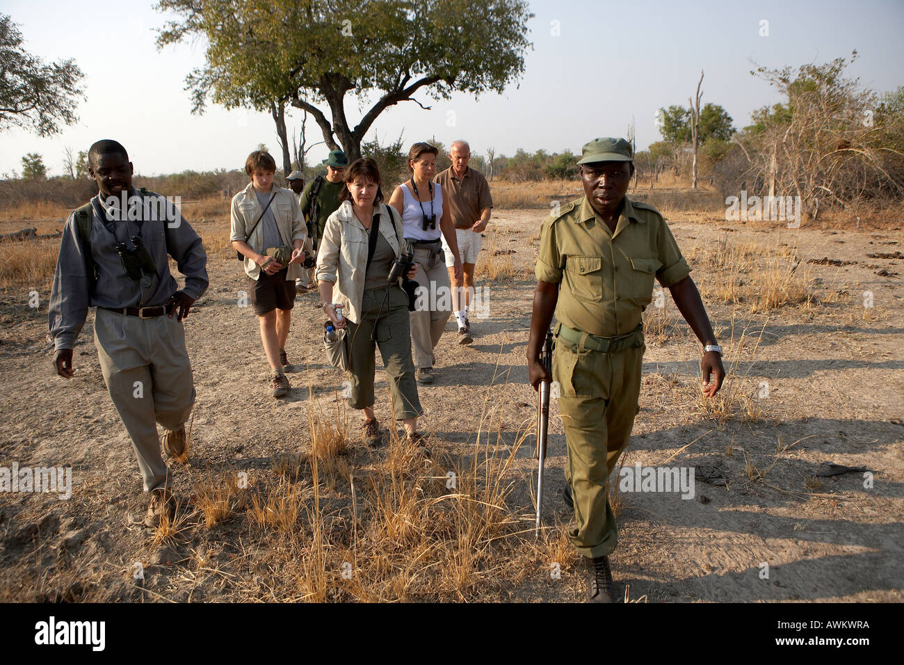 Walking safari africa rifle hi-res stock photography and images - Alamy