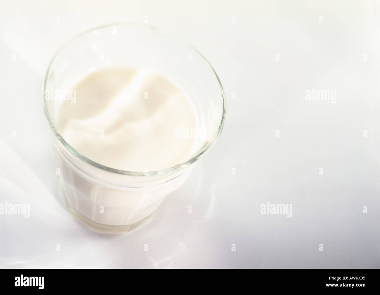 Glass of milk, elevated view Stock Photo - Alamy