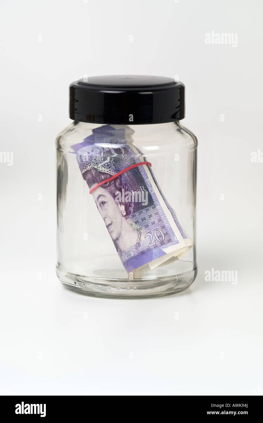 British bank notes in glass jar Stock Photo - Alamy