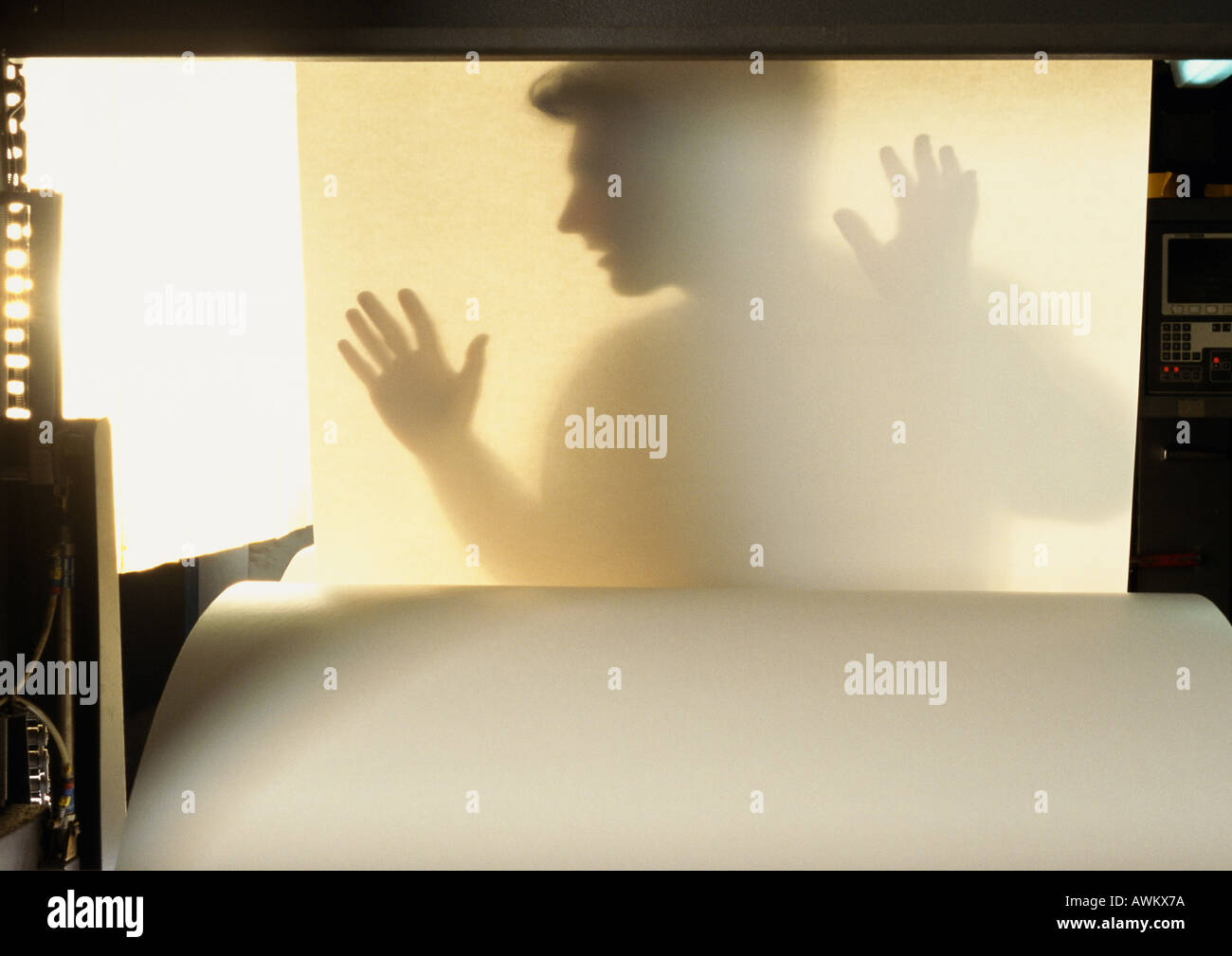 Silhouette of man behind sheet of paper Stock Photo - Alamy