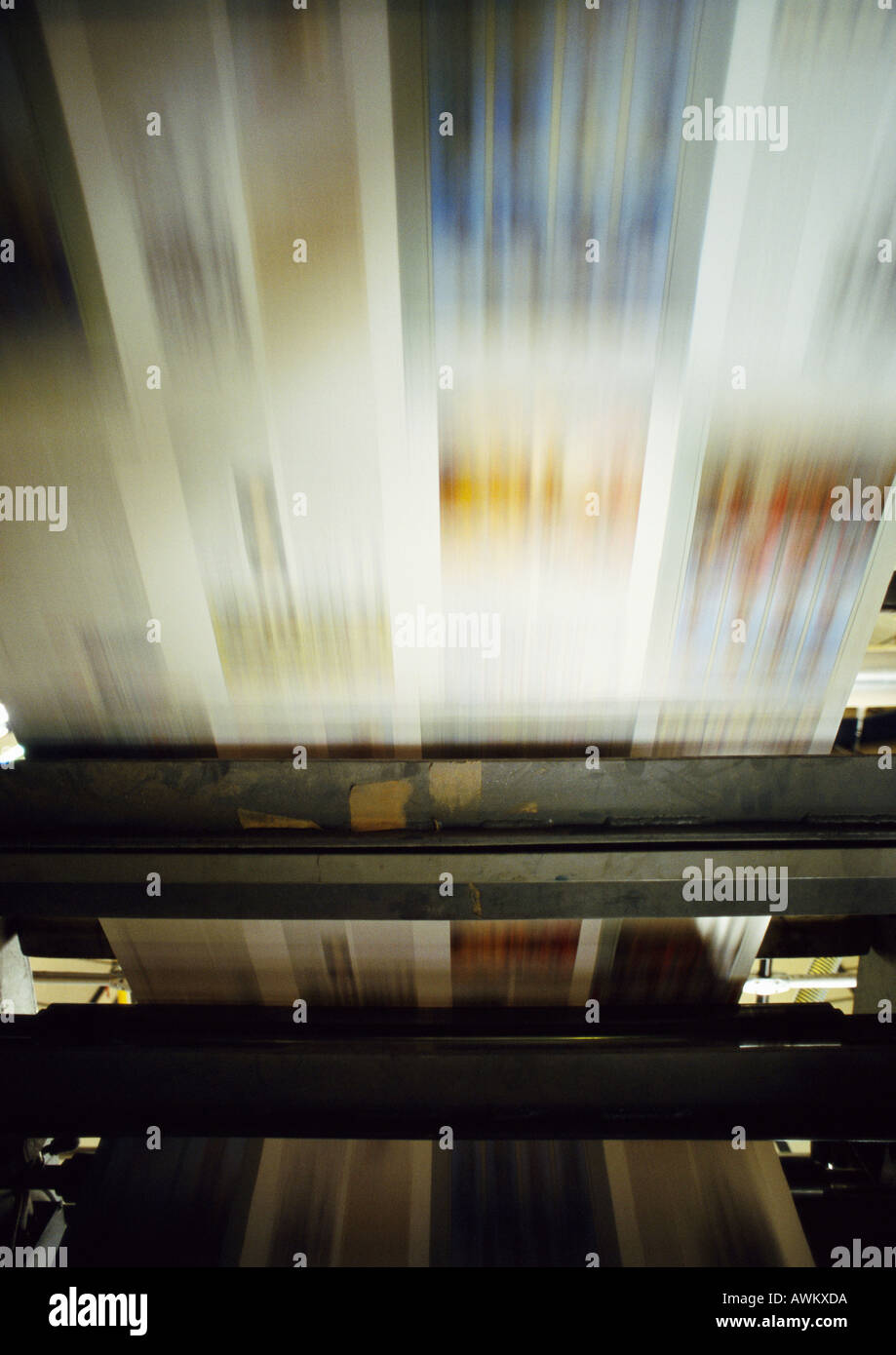 Printed paper on printing press, blurred motion Stock Photo - Alamy
