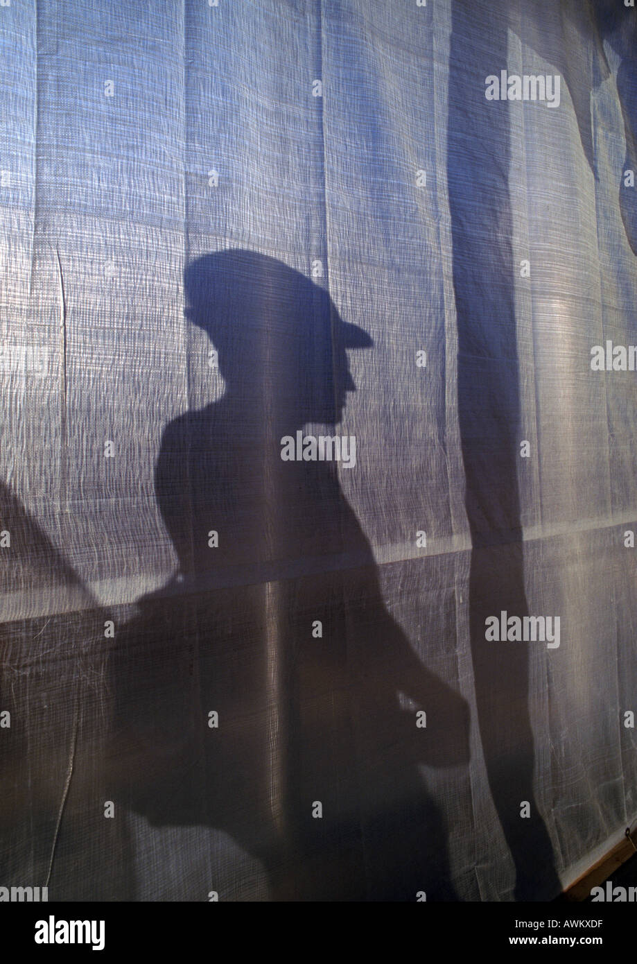 Shadow of man wearing hard hat Stock Photo - Alamy