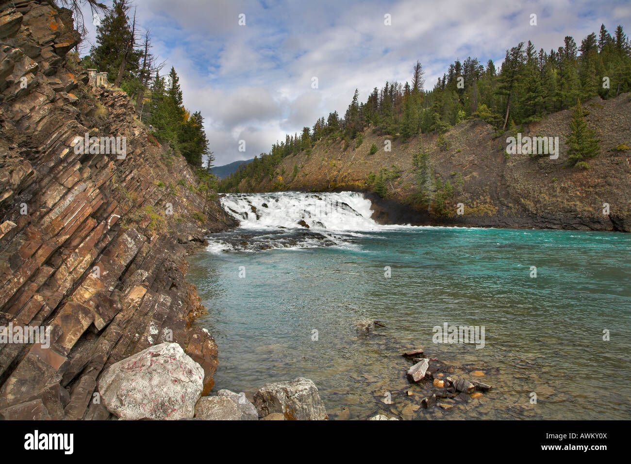 A bright color falls on the fast mountain river in mountains of Canada ...