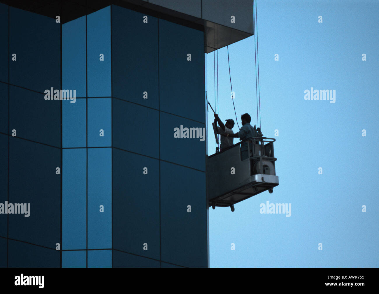Two men cleaning skyscraper's windows Stock Photo - Alamy