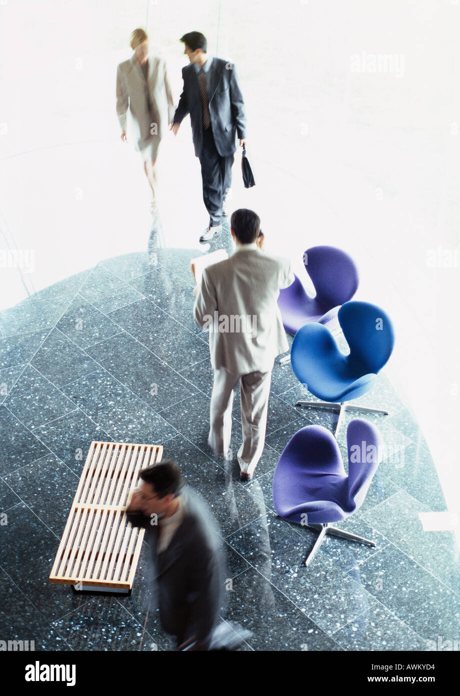 Business people standing in lobby, elevated view Stock Photo - Alamy