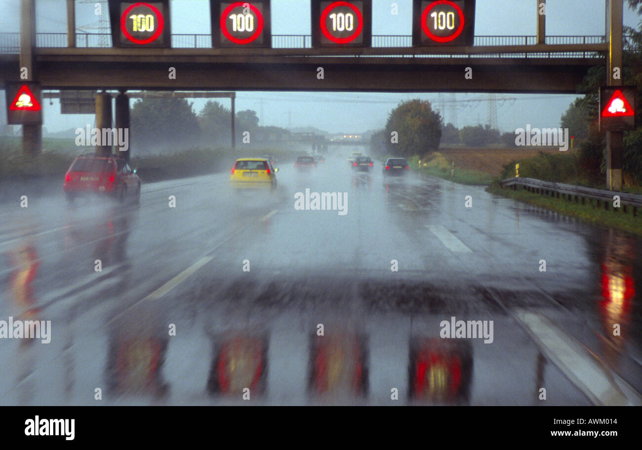 Cars on highway in rain Stock Photo - Alamy
