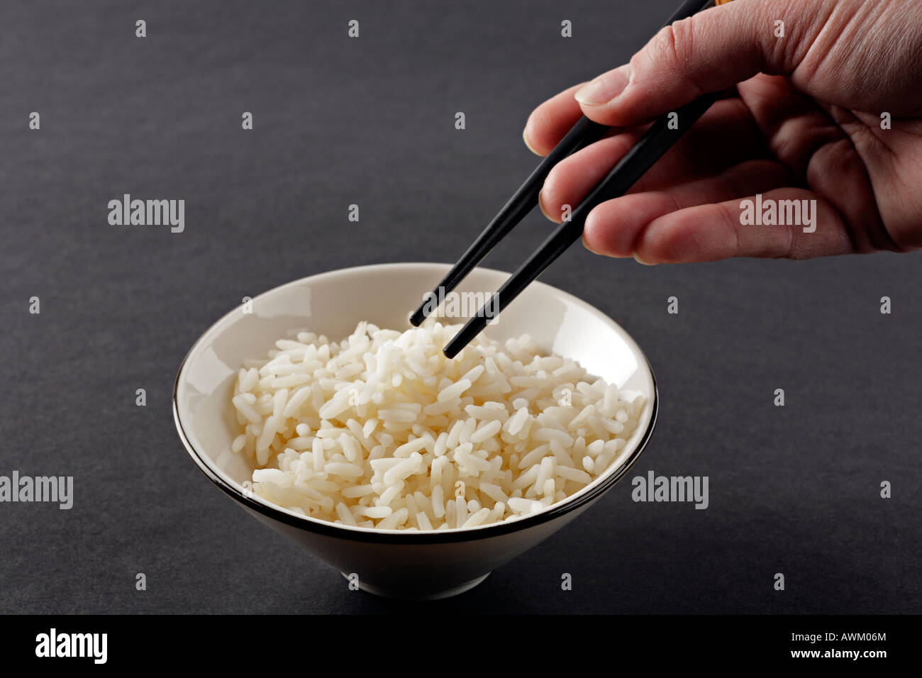 Hand with chopsticks hi-res stock photography and images - Alamy