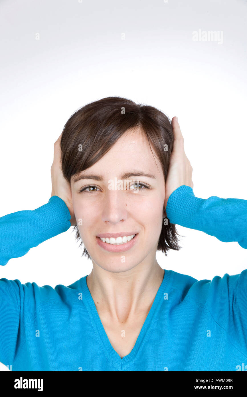 Young woman stressed by noise Stock Photo - Alamy