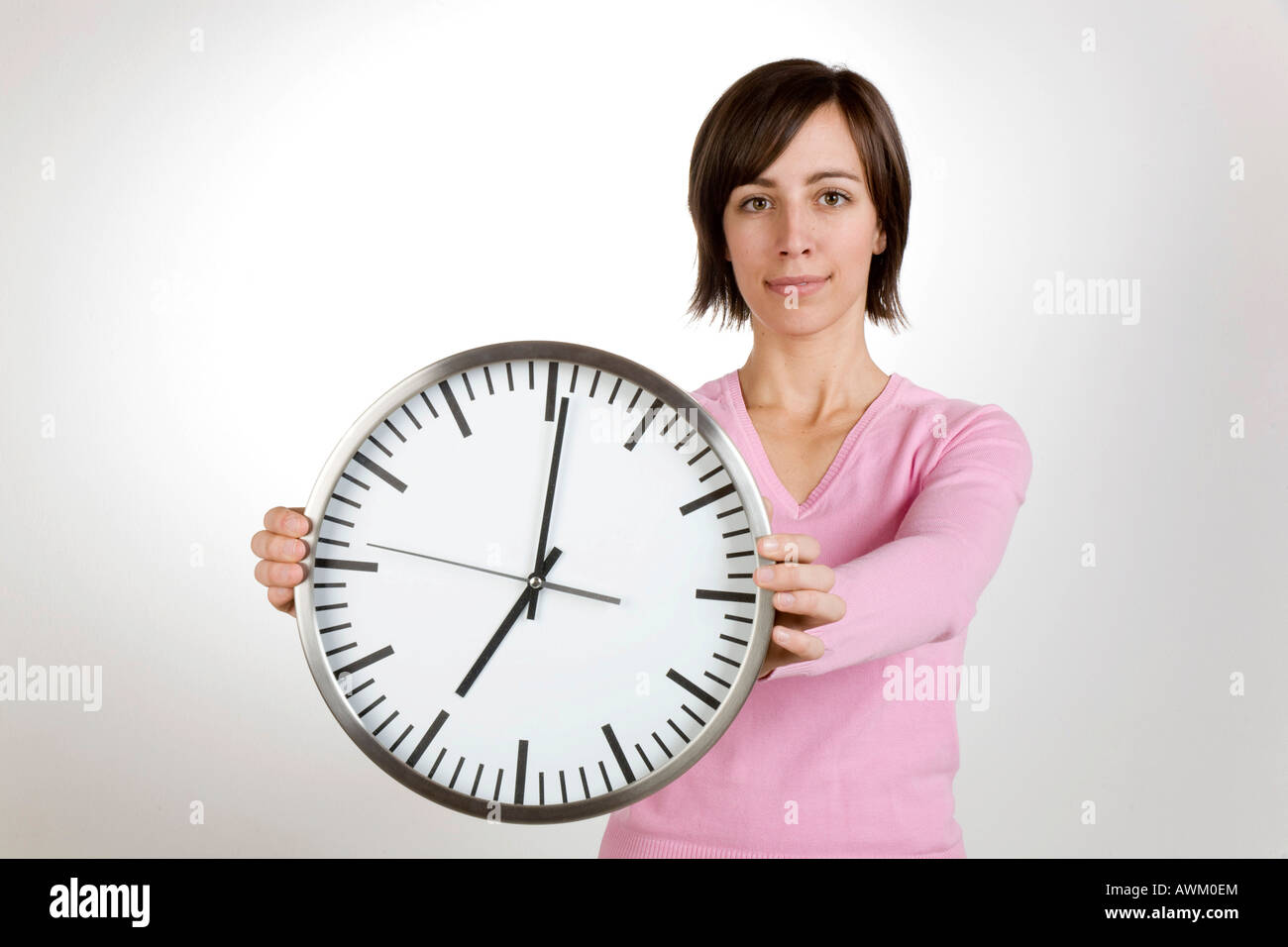 Woman with big clocks hi-res stock photography and images - Alamy