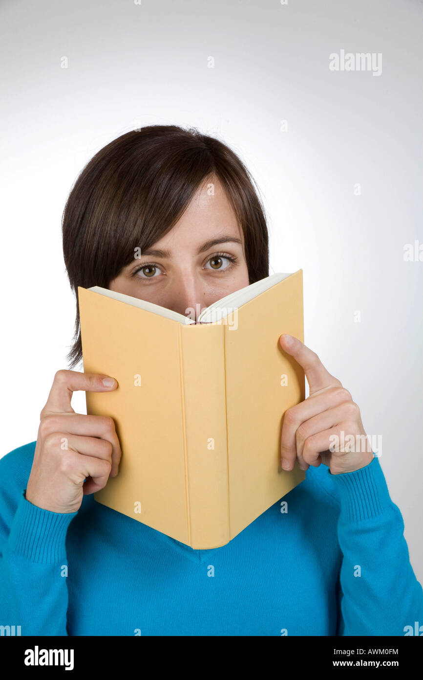 Young woman reads a book Stock Photo - Alamy