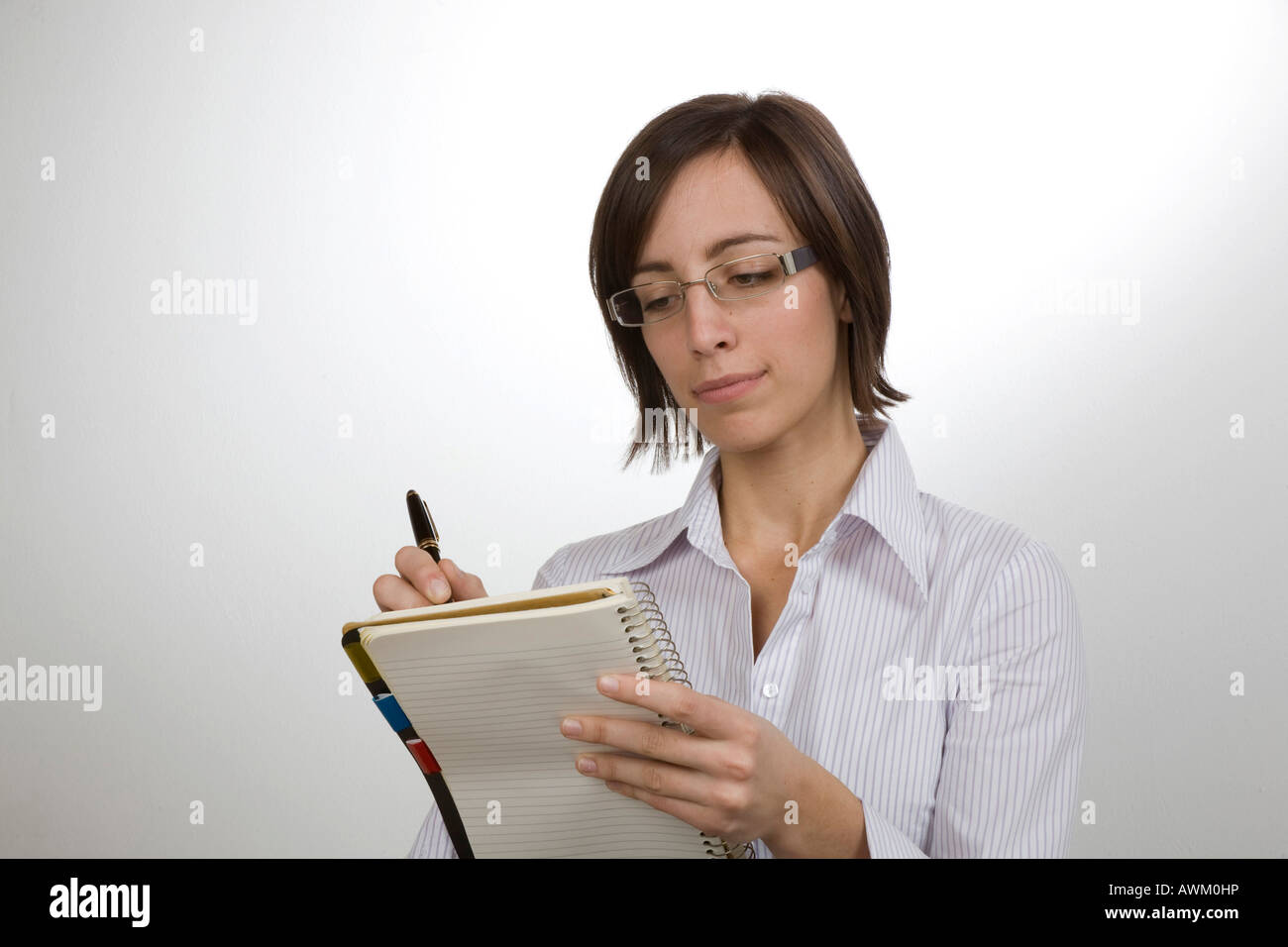 Executive assistant taking notes Stock Photo - Alamy