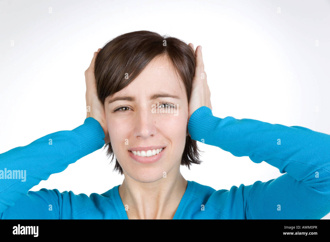 Young woman stressed by noise Stock Photo - Alamy