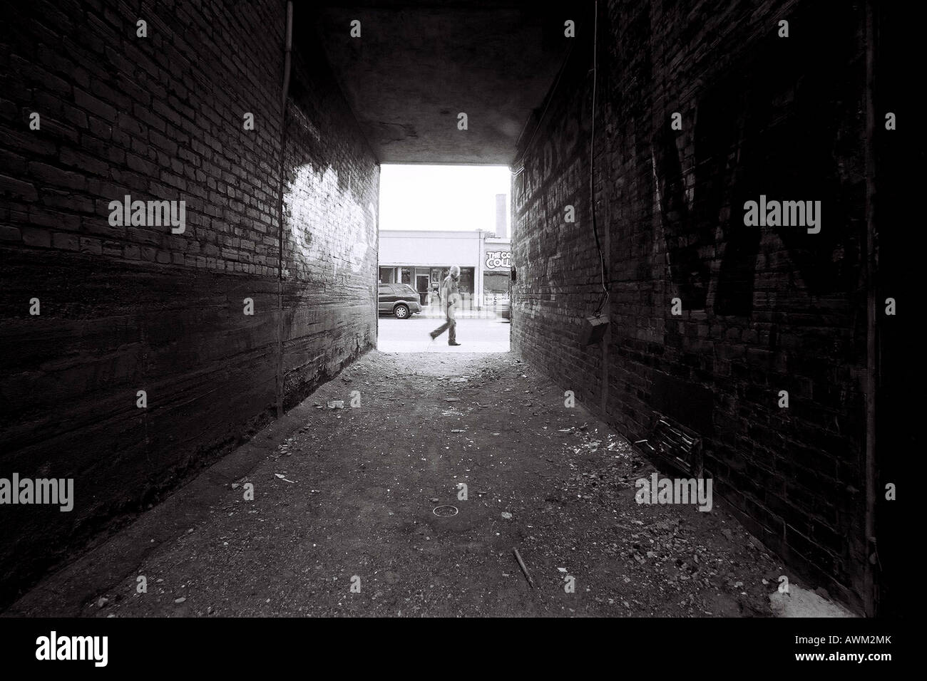 A street and alleyway in a city Stock Photo - Alamy