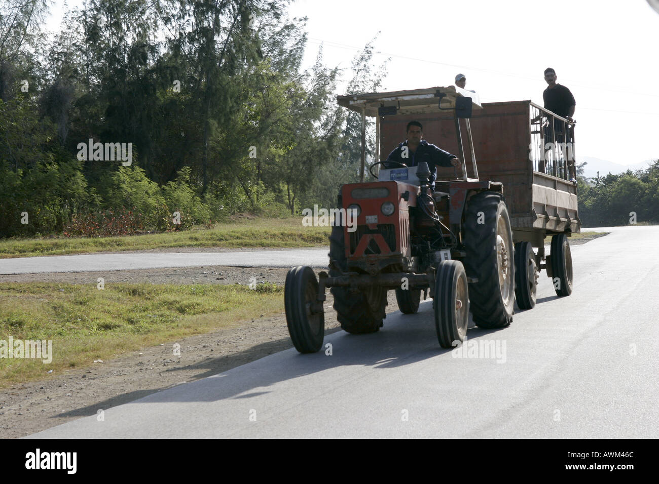 older tractor driving on street in Cuba Stock Photo - Alamy