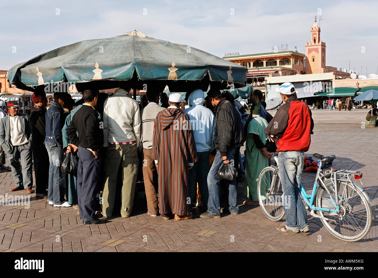 Listeners making a cercle around a arabic storyteller at Djemaa el-Fna ...