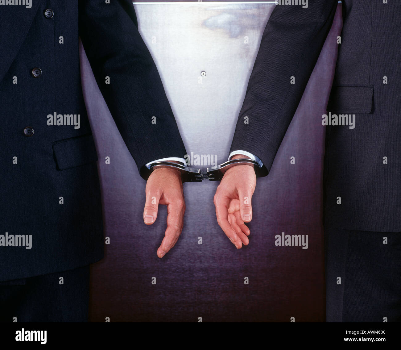 Handcuffed Wrist Stock Photos & Handcuffed Wrist Stock Images - Alamy