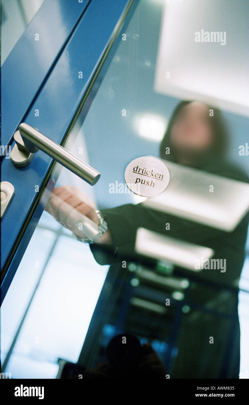 Person opening door Stock Photo - Alamy