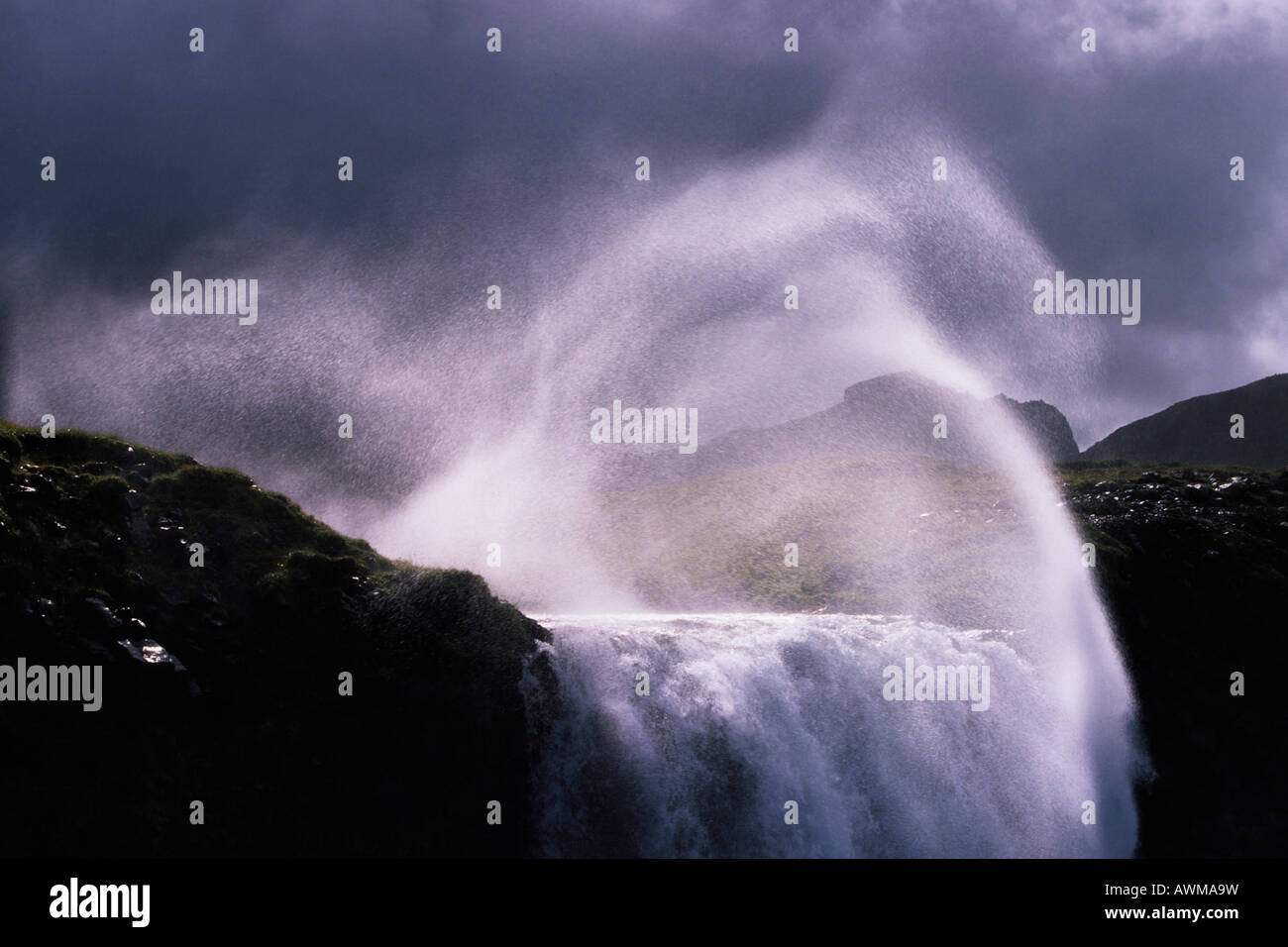 Waterfall spray, Iceland, Atlantic Ocean Stock Photo - Alamy