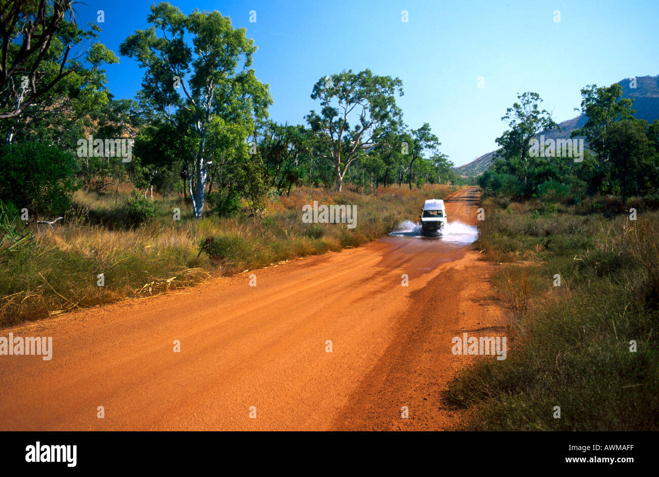 Jeep crossing water on road, Gibb River Road, Kimberley, Australia ...