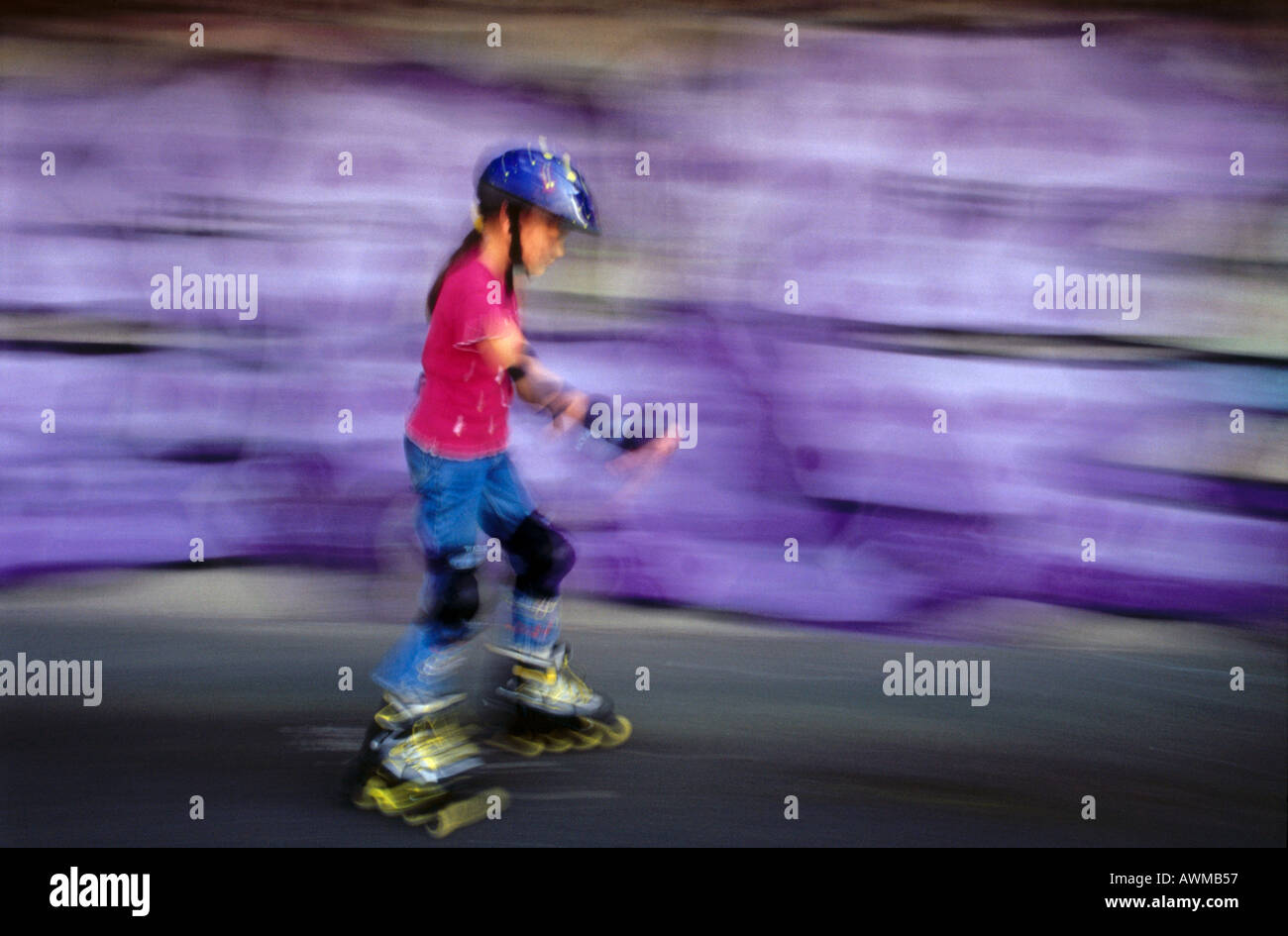 Side profile of girl roller skating Stock Photo - Alamy