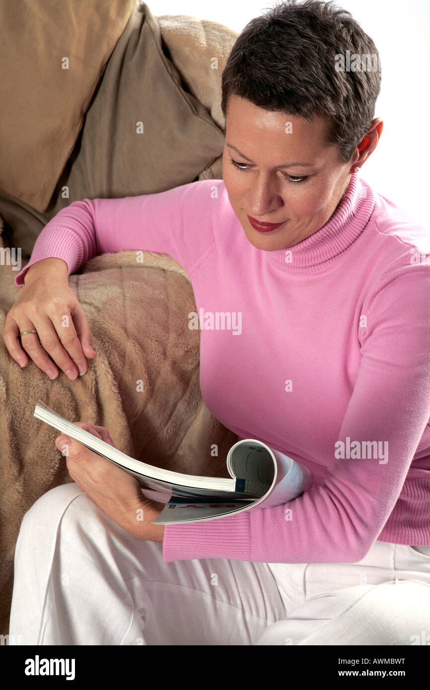 Woman reading magazine Stock Photo - Alamy