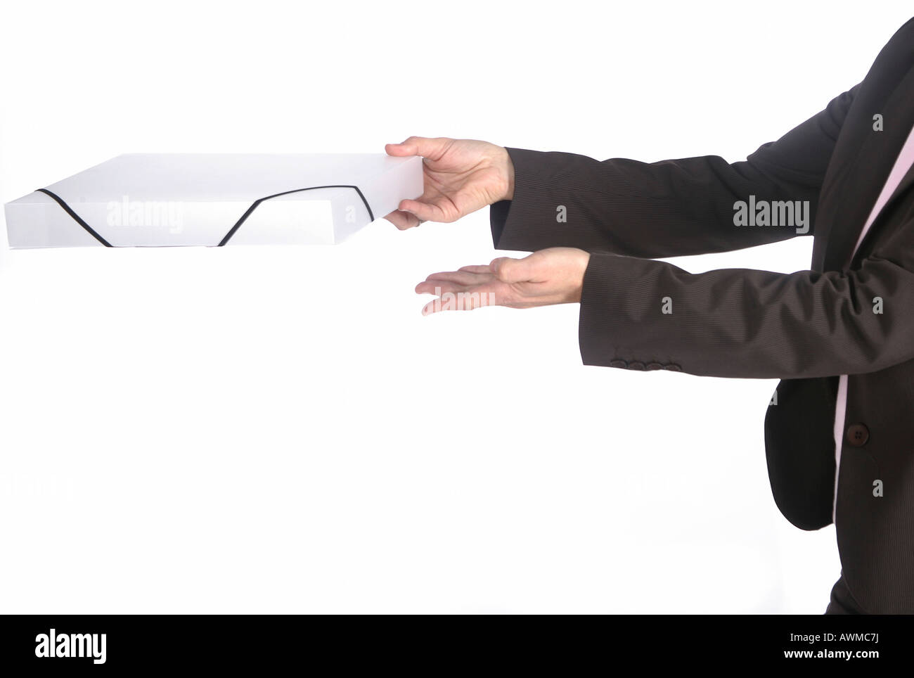 Woman handing over office folder Stock Photo - Alamy