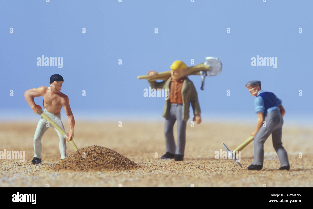 Close-up of figurines of construction workers Stock Photo - Alamy