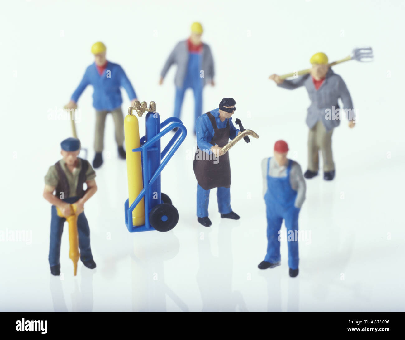 High angle view of figurines of construction workers Stock Photo - Alamy