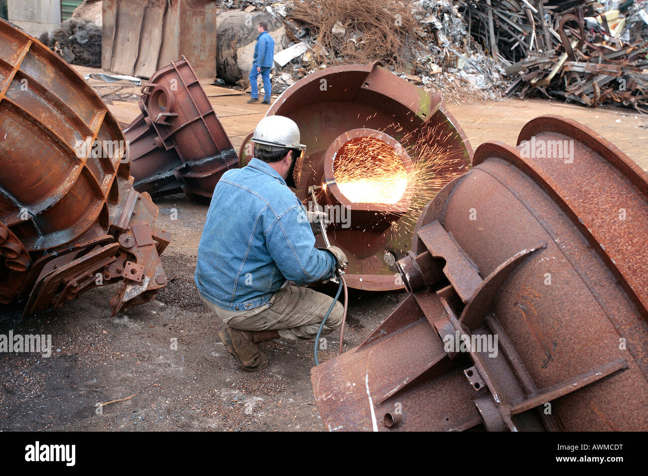Welder on scrapyard Stock Photo - Alamy