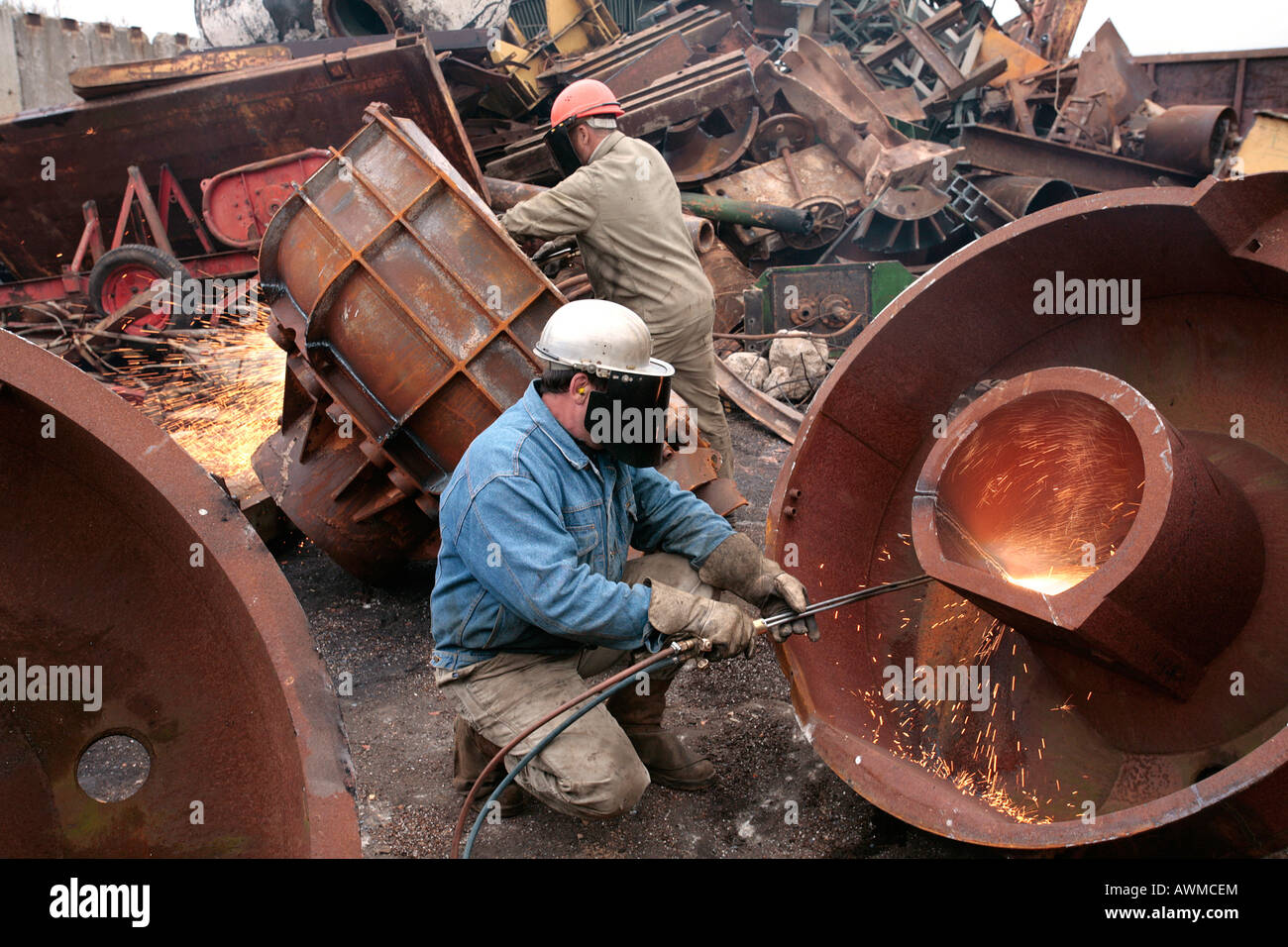 Welder on scrapyard Stock Photo - Alamy