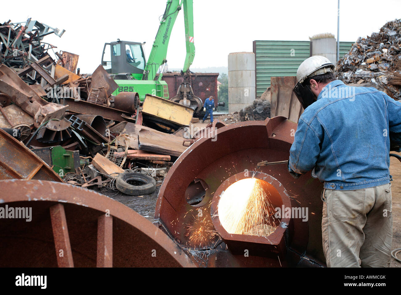 Welder on scrapyard Stock Photo - Alamy