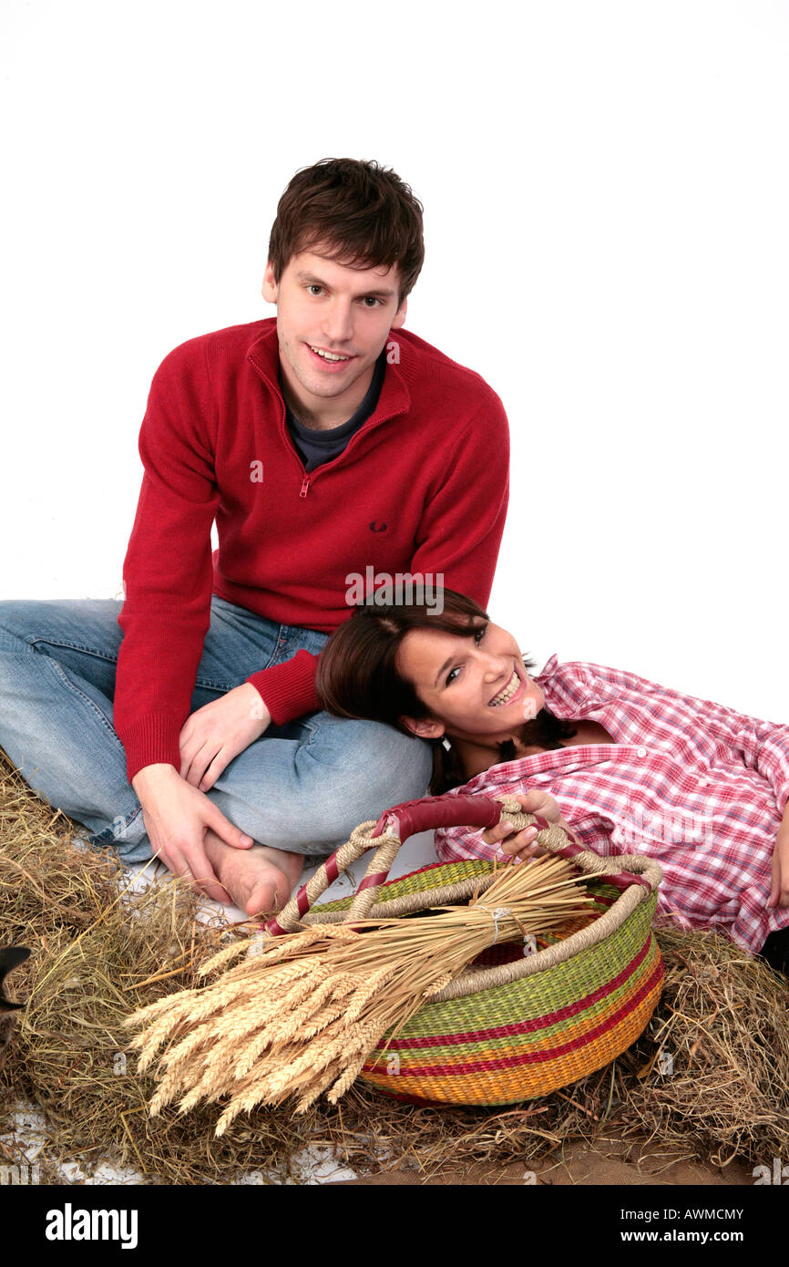 Farmer with girl in the hay Stock Photo - Alamy