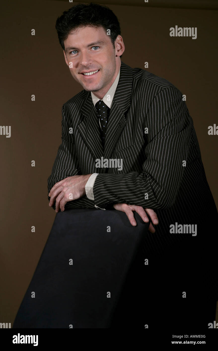 Businessman leaning over office chair hi-res stock photography and ...