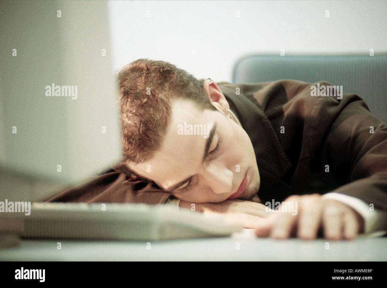 Man sleeping in office Stock Photo - Alamy