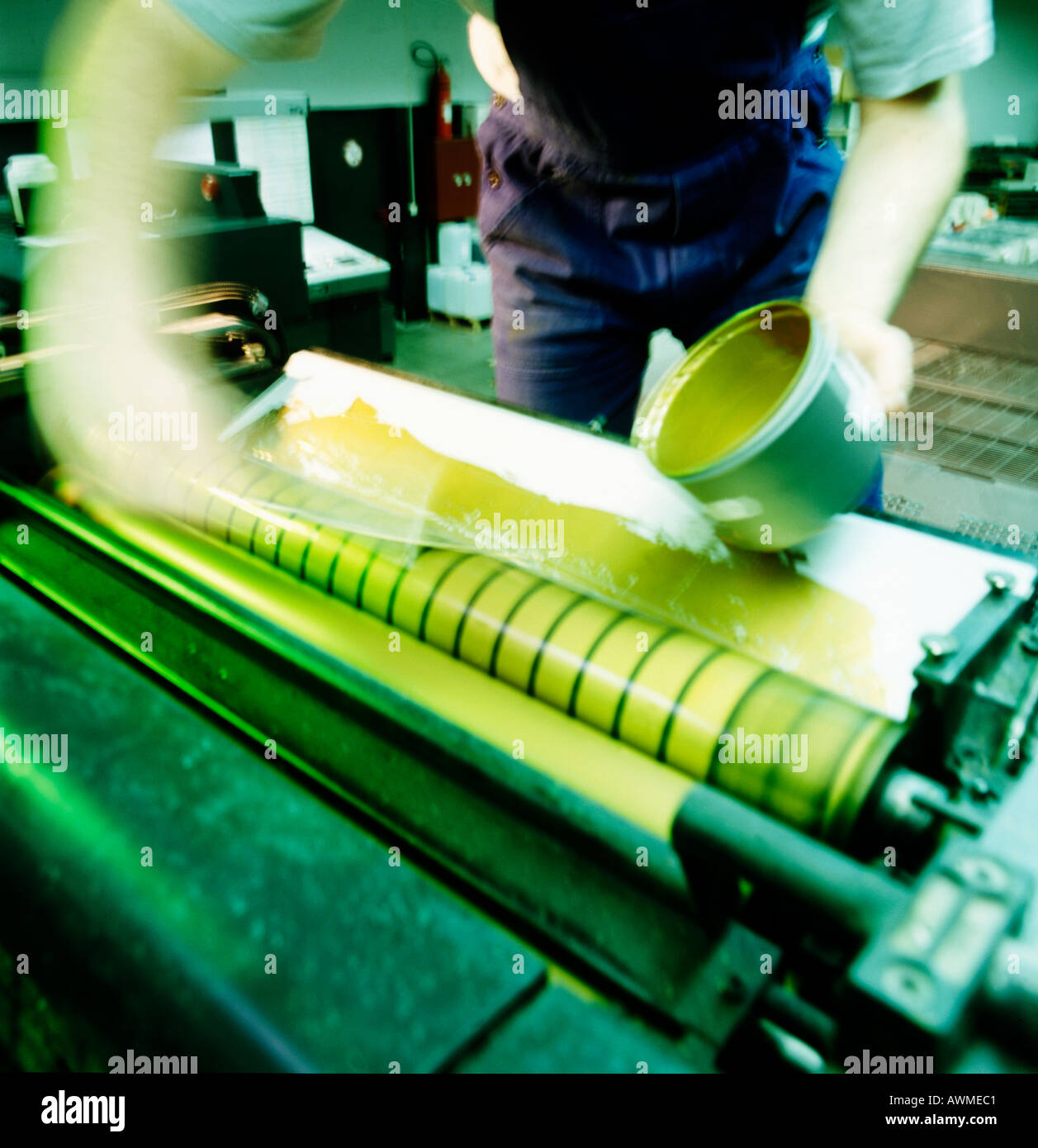 Mid section view of man working in printing press Stock Photo - Alamy