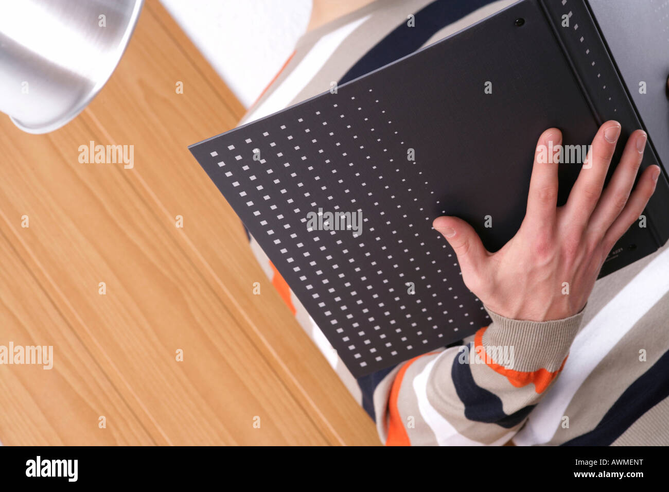 Young man holding a file in his hand Stock Photo - Alamy