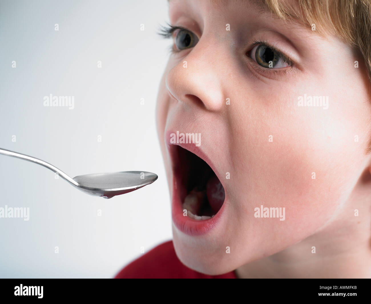 Children taking medicine hi-res stock photography and images - Alamy