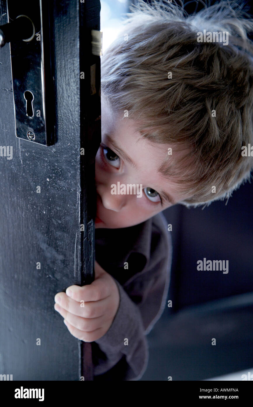 Peeking around door hi-res stock photography and images - Alamy